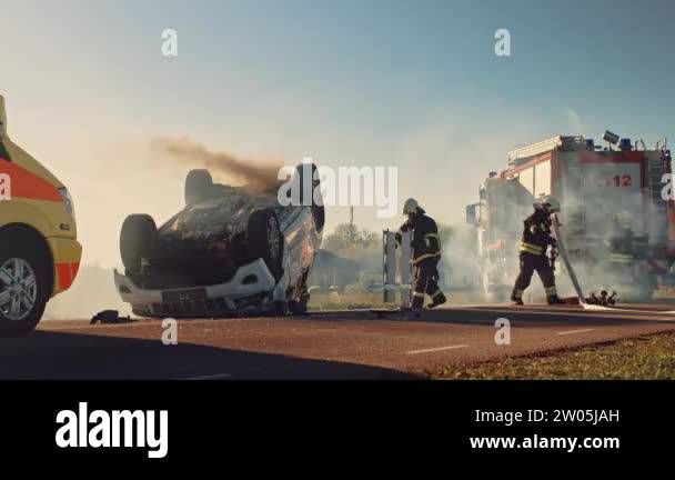 Paramedics and Firefighters Arrive On the Car Crash Traffic Accident ...