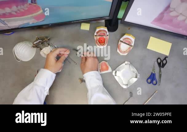 dental prosthesis laboratory with dentures, tools, porcelain tooth ...