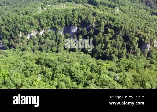 Aerial video shooting. Green forest. Highest mountain. The fissure in ...