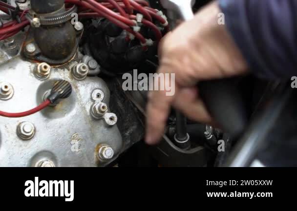 Slow Motion of mechanic repairs old motor of vintage car in a repair ...