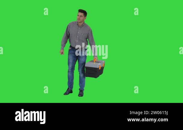 Male contraction worker ready for work Casual man with tools walks in ...