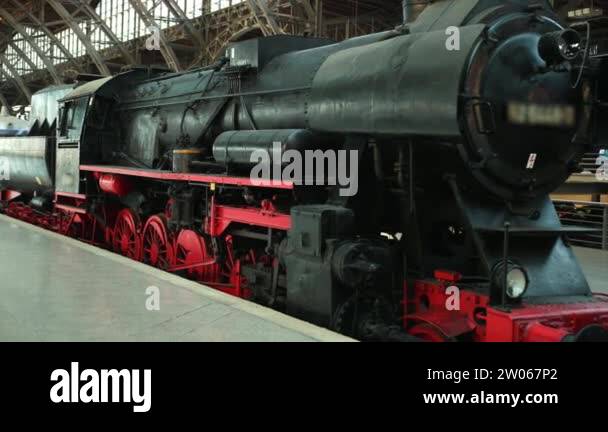 Heavy industrial steam locomotive train red and black engine wheels is ...