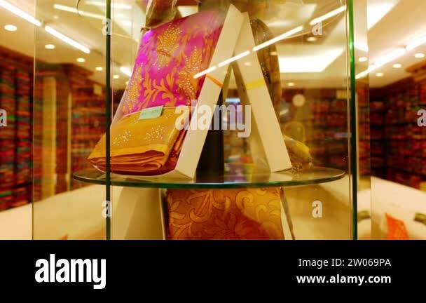 Indian traditional costume Sari store in Chennai, India. Rotating ...