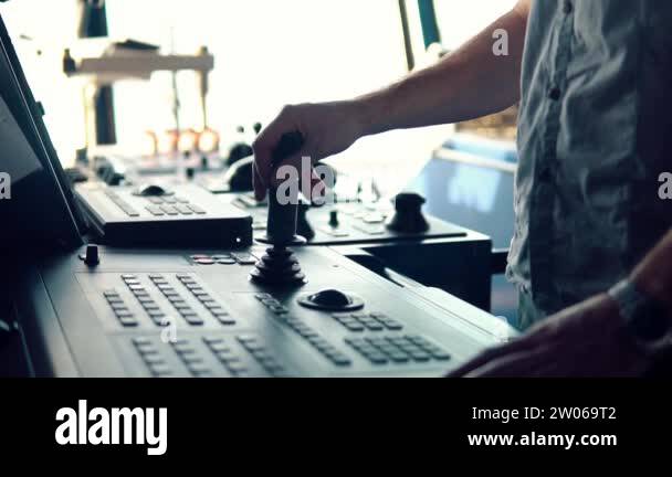 dynamic positioning officer operationg bridge ship equipment of vessel ...