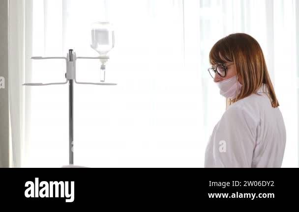 Dropper counter with medication modern clinic, Female nurse adjusting ...