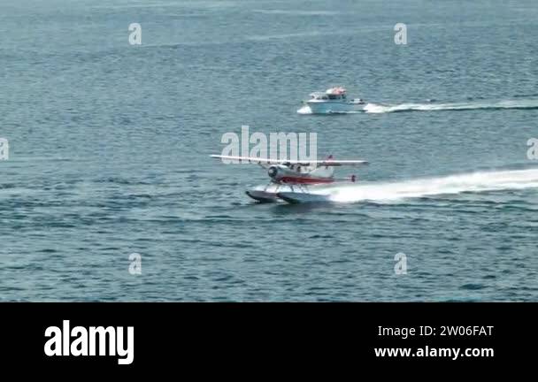 Seaplane Close-up Taking Off from the Water in Alaska during a Hot and ...