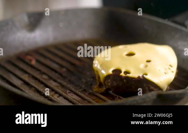 chef spatula picks up pair of juicy meat patties with crispy brown ...