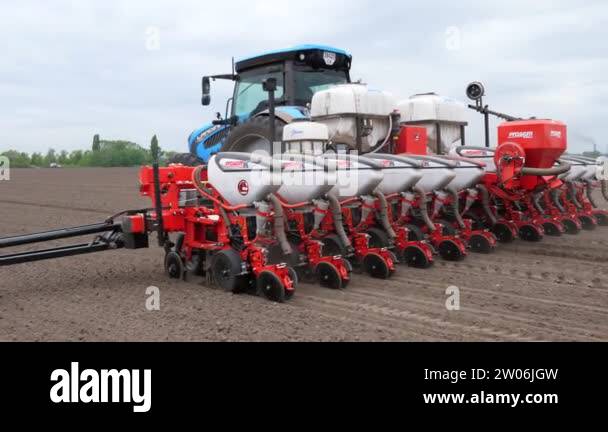 close-up, tractor with special precision planters, seeder is working in ...