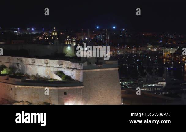 Panoramic night view of a coast line and the downtown of Valletta ...