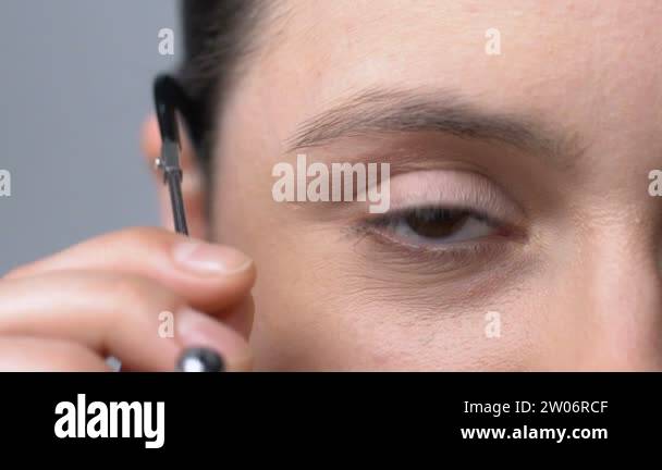 Lady putting on ophthalmic testing device for eye examination and lens ...