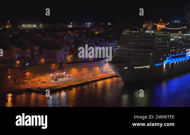 Panoramic night view of a coast line and the downtown of Valletta ...