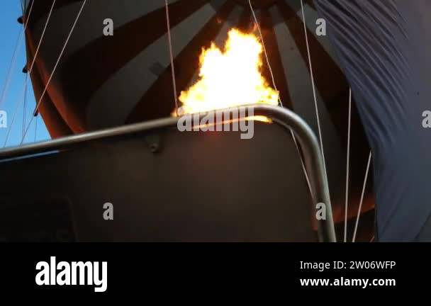 A bright, large flame of yellow color directed into the dome of the ...