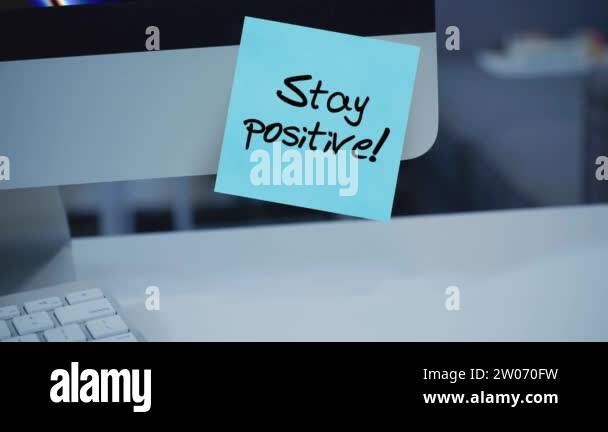 Stay positive. The inscription on the sticker on the monitor. Message ...