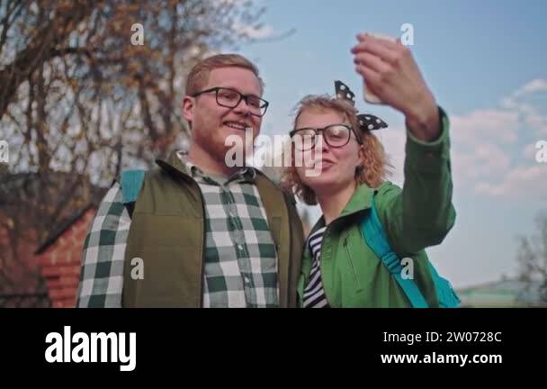 Young, beautiful couple, makes selfie in the old town. Young Finnish ...