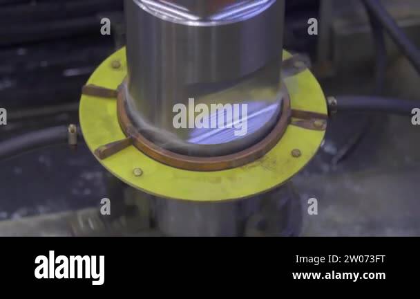 Metal induction hardening machine. Process of quenching metal with a ...