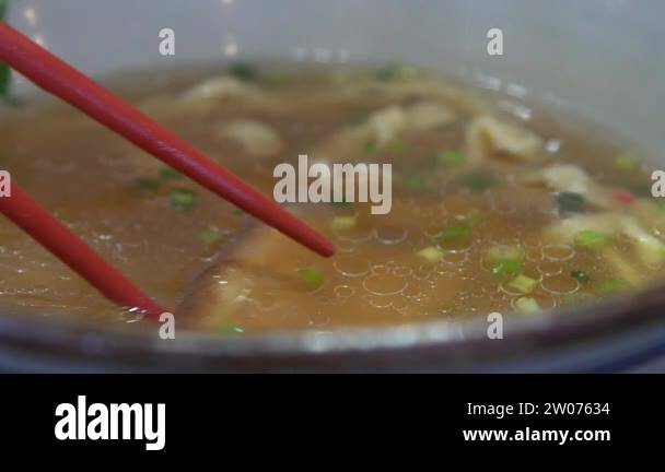Slow Motion of people eating noodles with pork in a japanese restaurant ...