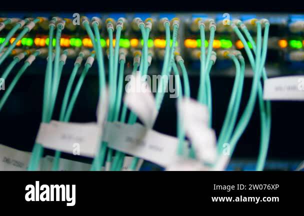 Green cables connected to a computer with lights at a server room Stock ...