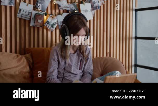 E-learning on self isolation. Young cute Caucasian teenage girl studies ...