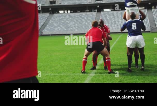 Front view of diverse rugby players playing rugby match in stadium ...
