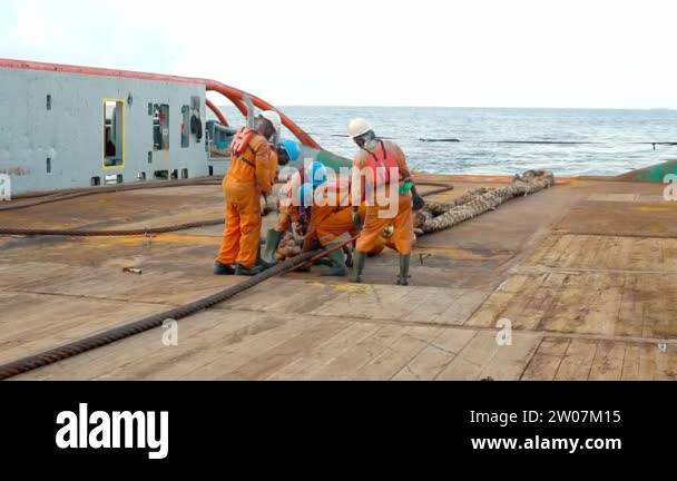 Anchor-handling Tug Supply AHTS vessel crew preparing vessel Stock Video Footage - Alamy
