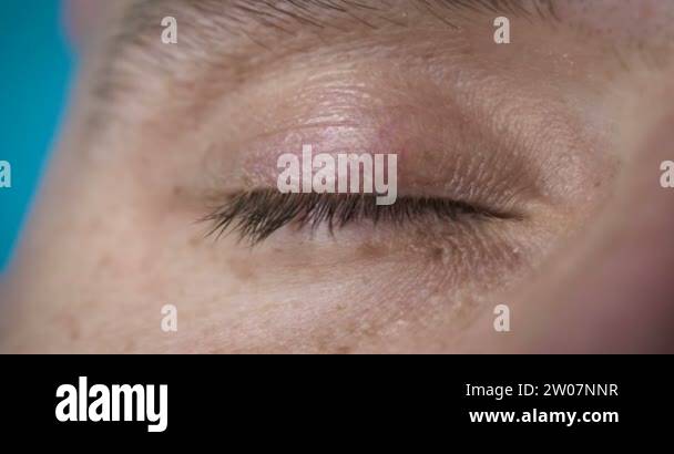 The human eye is depicted very closely with the brown (hazel) color of ...