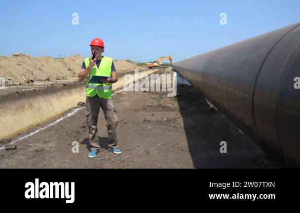 Engineer Talking Over Radio Communication Device at Gas Pipeline ...