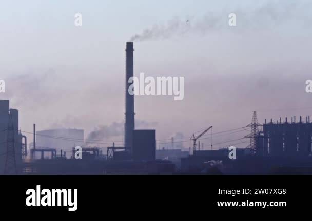 Billowing steam from smoke stack filling sky. Smoking chimneys of a ...