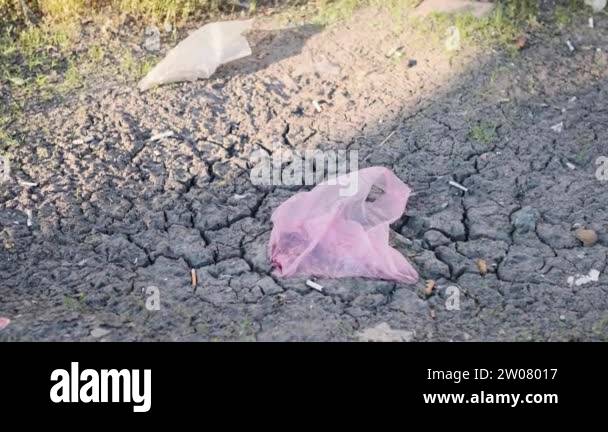 Pollution of plastics on the ground. Plastic waste lies on the ground ...