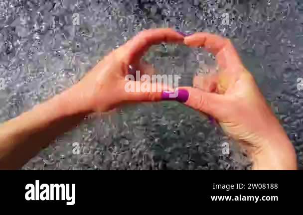 pure beauty and ECO-friendliness, heart by hands on the reservoir of ...