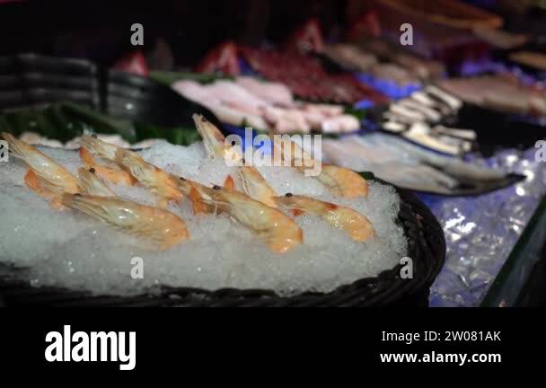 4K, fresh raw seafood and sashimi in buffet line at Taiwan. Salmon ...