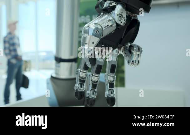 Future today. Robotic arm manipulator rotates in the rays of the sun ...