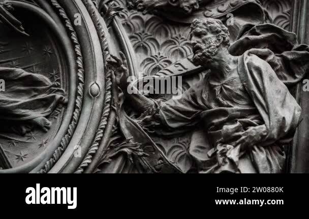 Beautiful Duomo di Milano iron gates decor in close up.Jesus Christ ...