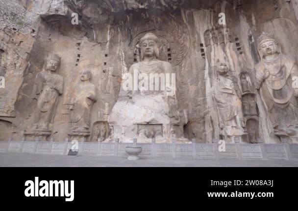Panorama of the giant buddhist sculptures in the main Longmen Grotto ...