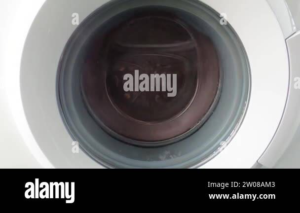 Washing machine spinning clothes, while increasing its speed ...