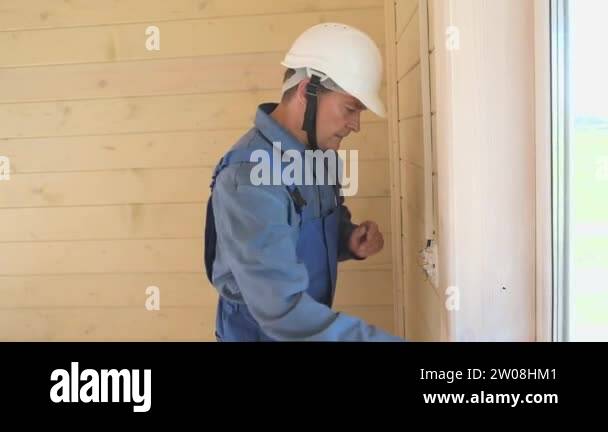 professional electrical engineer performs installation of electrical ...