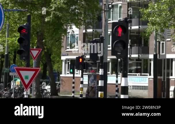 Amsterdam, Netherlands-13 May, 2019: European pedestrian crosswalk sign ...