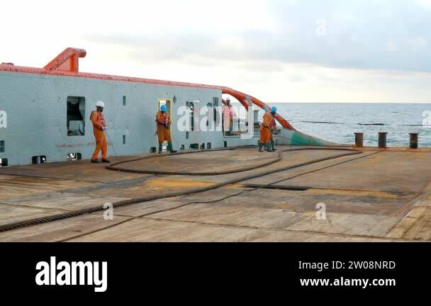 Anchor-handling Tug Supply AHTS vessel crew preparing vessel Stock Video Footage - Alamy