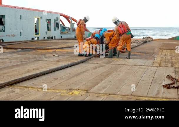 Anchor-handling Tug Supply AHTS vessel crew preparing vessel Stock Video Footage - Alamy