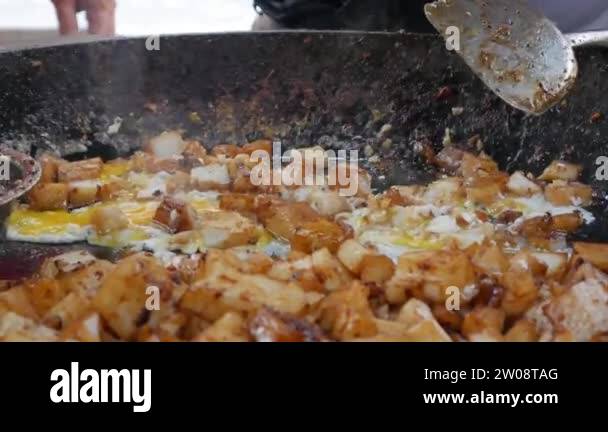 Cooking of Chinese traditional white radish cake dish call Fried Koay ...
