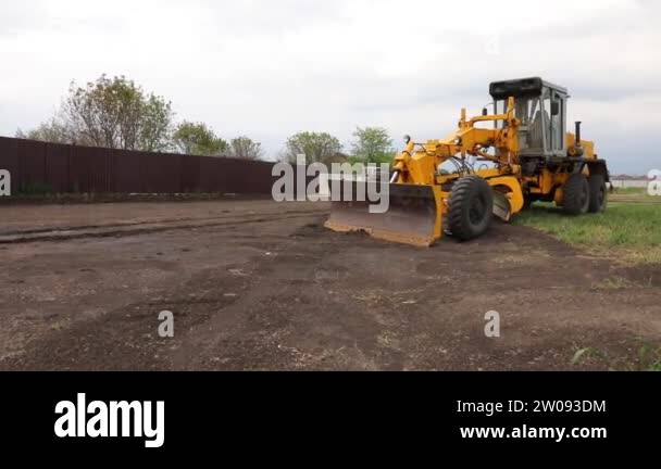 Yellow bulldozer with bucket. Wheel Loader. Yellow Front Loader. Heavy ...