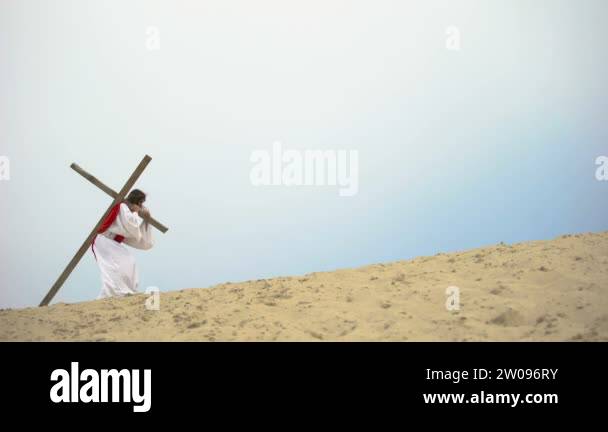 Jesus with heavy wooden cross hardly walking, biblical story of ...