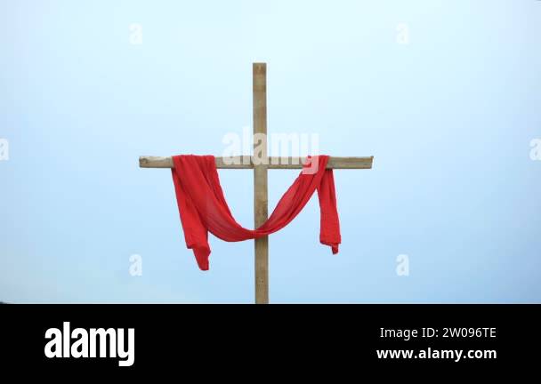 Wooden cross with red cloth wrapped around, crucifix and resurrection ...