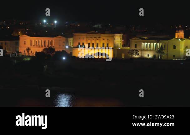 Panoramic night view of a coast line and the downtown of Valletta ...