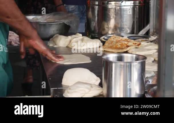 Male hands making traditional Indian food called Roti Canai. 4k Stock ...
