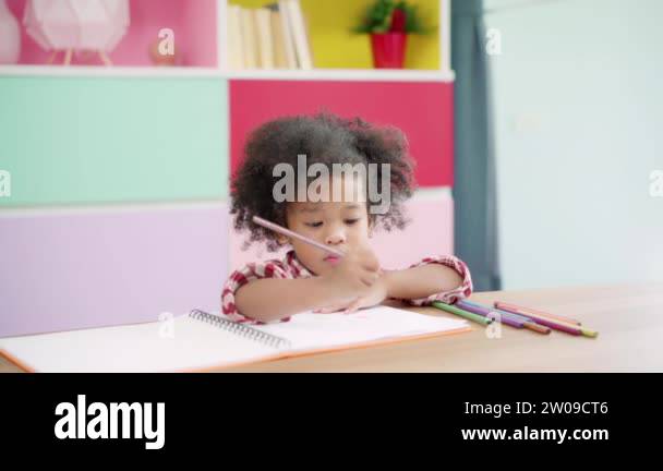 Slow motion - African kids drawing and do homework in classroom, young ...