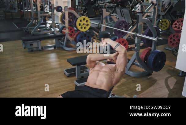 Bodybuilding man good looking doing exercises for development the ...