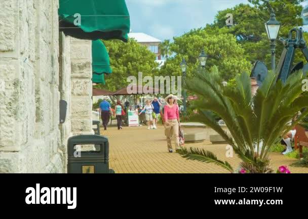 People Walking on a Paved Pathway while Shopping Local Arts and Crafts ...