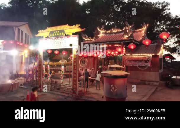 People visit Thai Pak Koong Temple Tanjung Tokong decorated with red ...