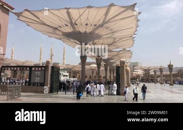 MEDINA, KINGDOM of SAUDI ARABIA-CIRCA MAY 2019 : Muslims walk in to ...