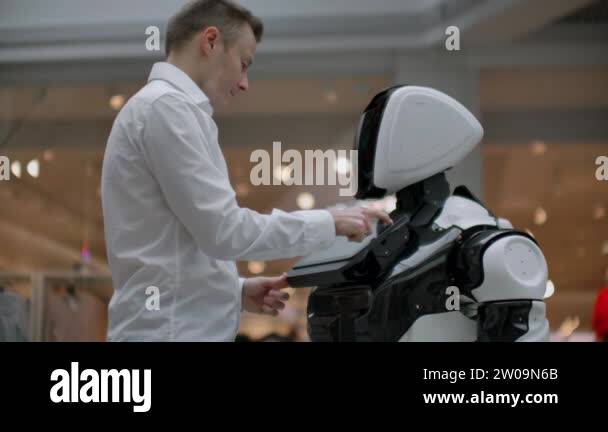 Electronics engineer working, scientist inventor on robot construction. slow-motion. modern ...